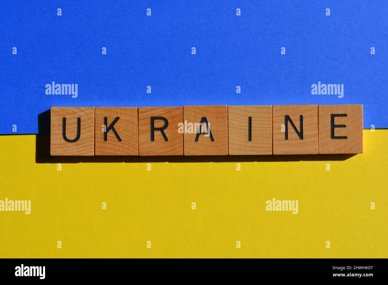 Ukraine, word in wooden alphabet letters isolated on blue and yellow ...