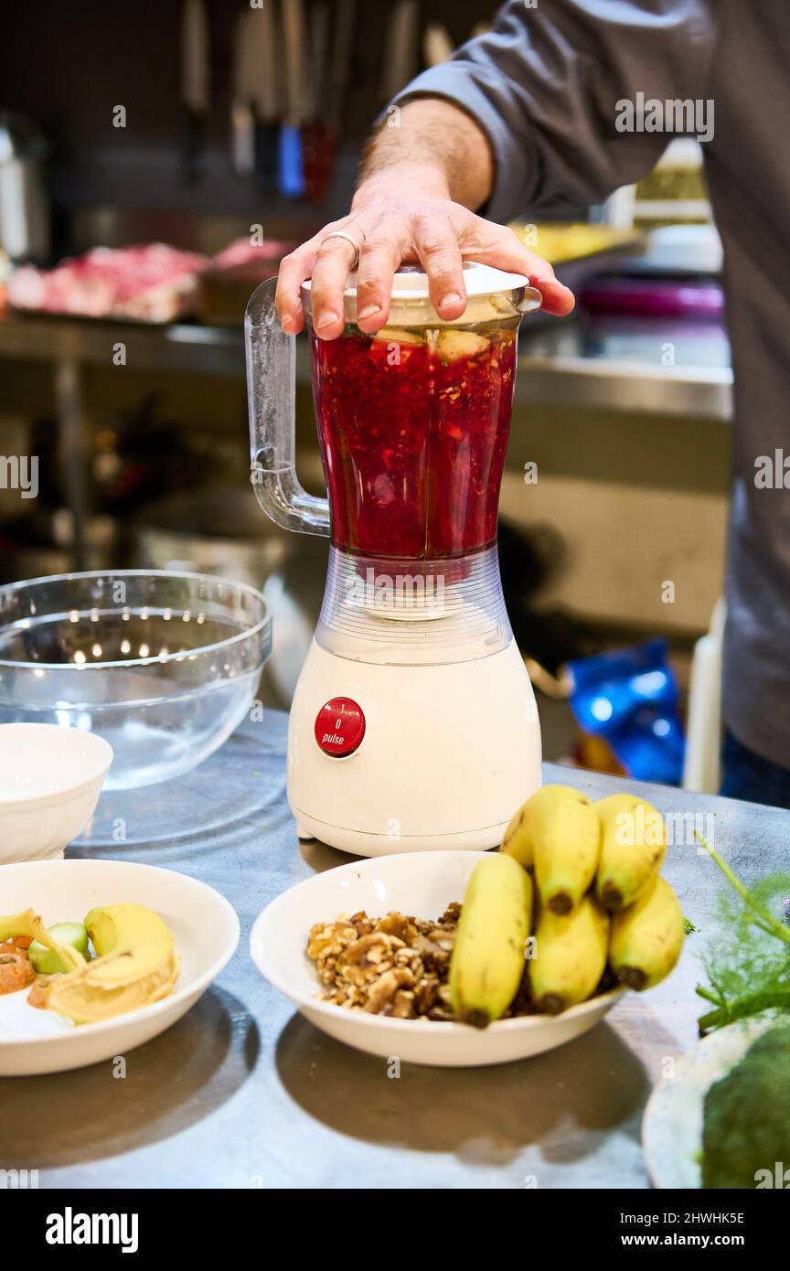 Different types of fruits in the blender to make a healthy juice Stock ...
