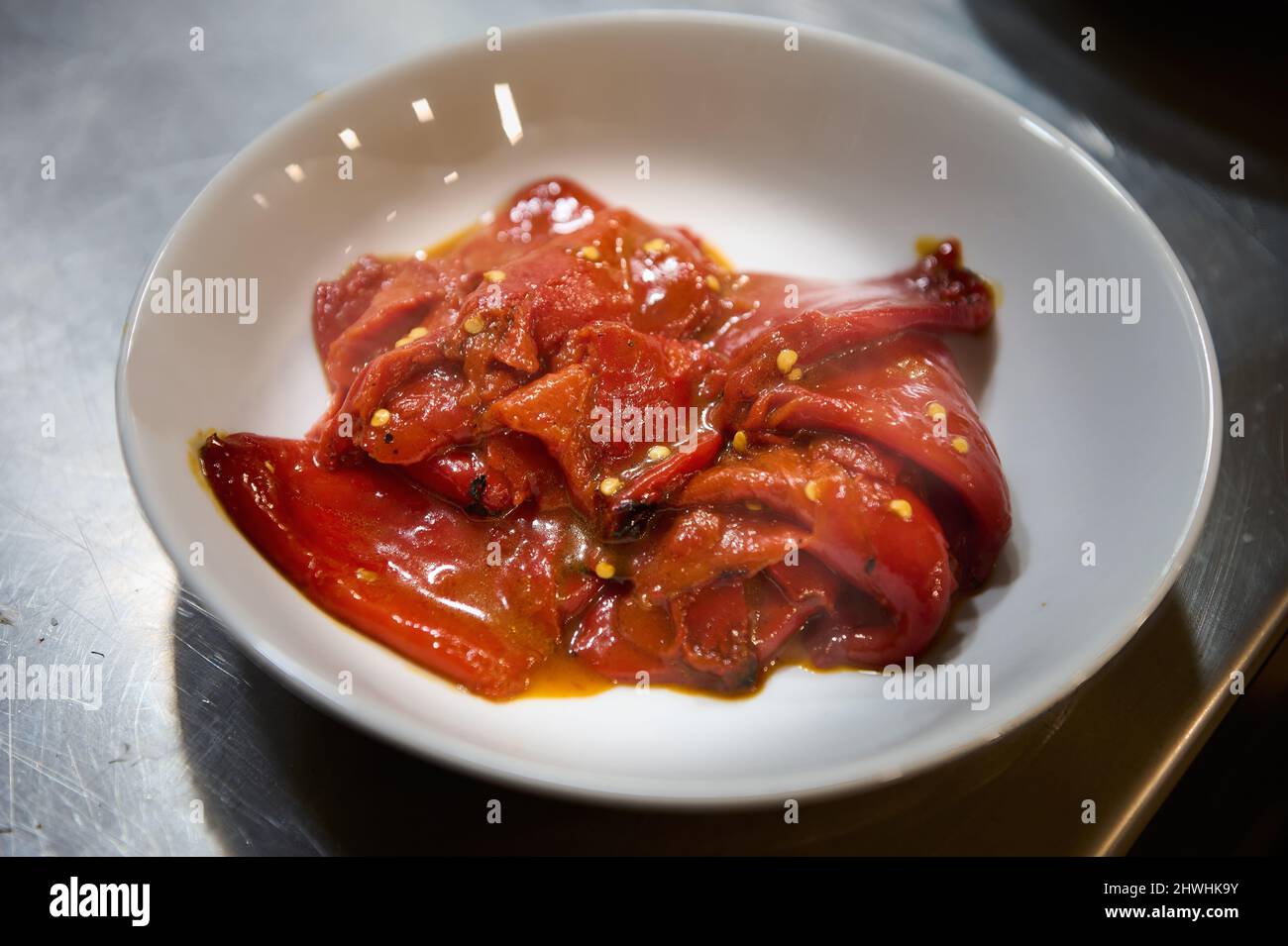 Fried red peppers with olive oil Stock Photo - Alamy