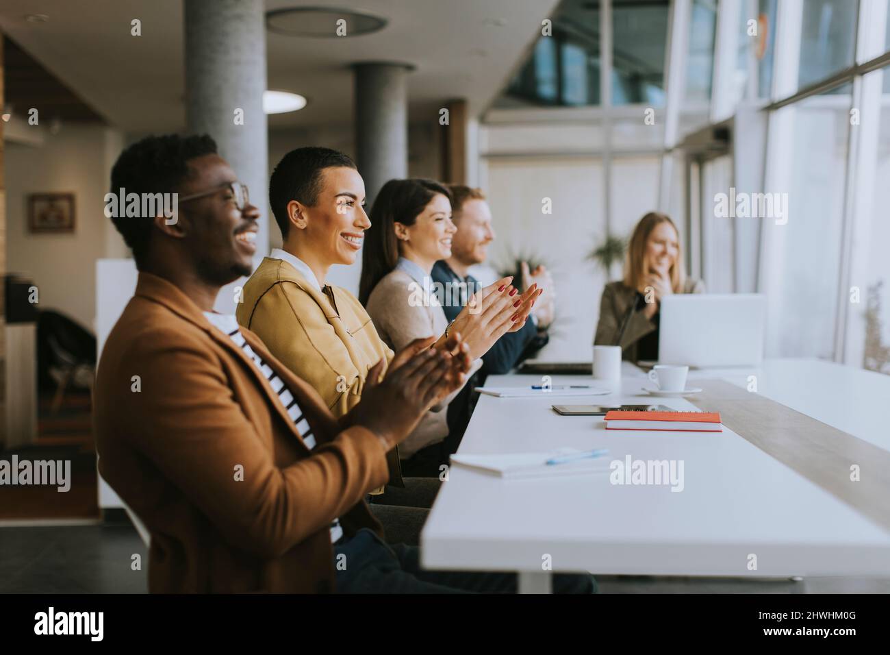 Group of young business people working together and preparing new ...