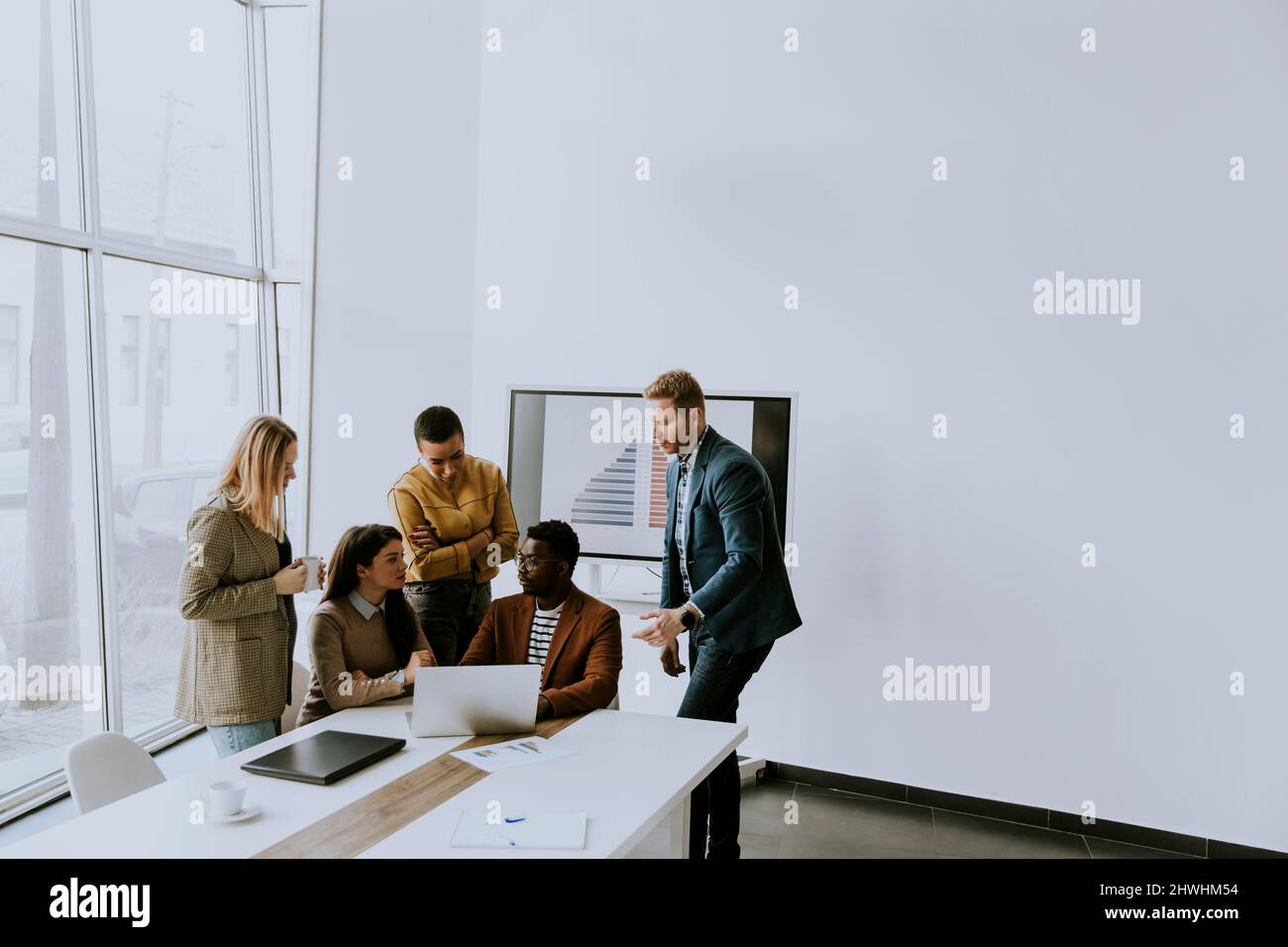 Group of young multiethnic business people working together and ...