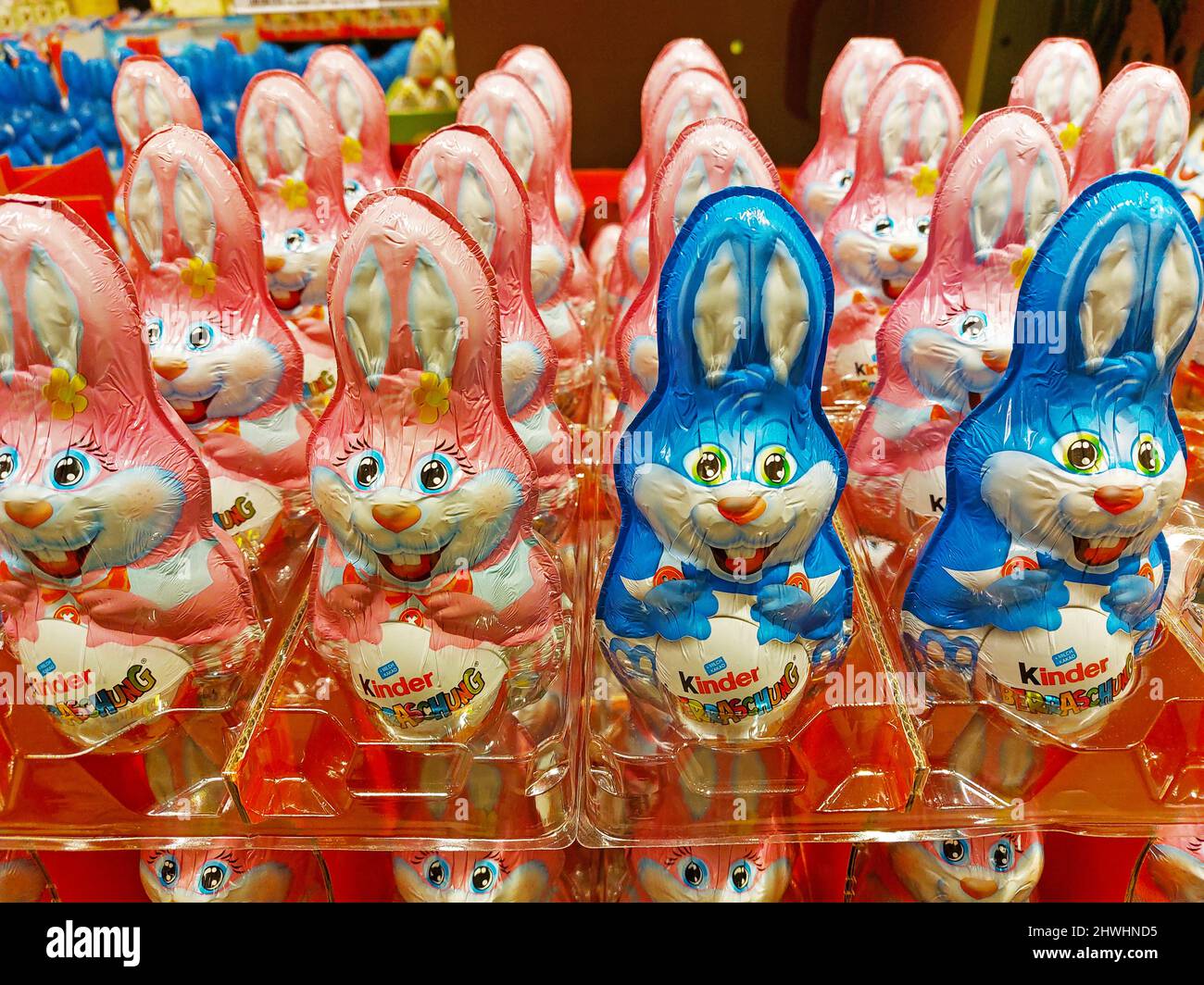 pink and blue chocolate easter bunnies made by Kinder in a supermarket ...