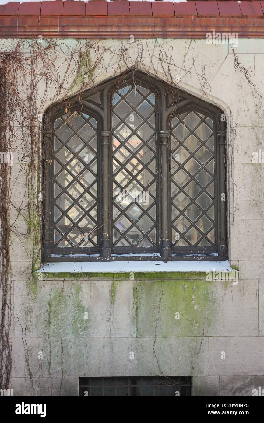 A elaborate carved stone window created in the Gothic medieval style ...