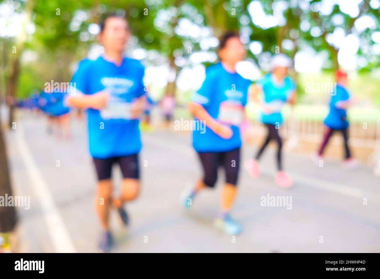 Blurred group of marathon running people in park, Athletic sport ...
