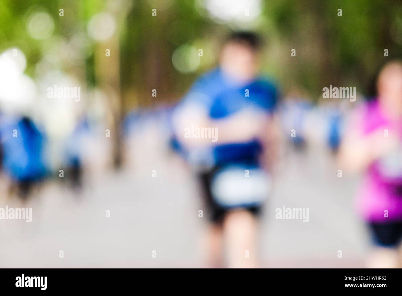 Blurred group of marathon running people in park, Athletic sport ...