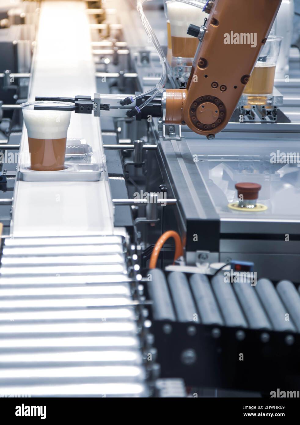 Robotic arm pouring and serving a glass of beer on belt conveyor Stock ...