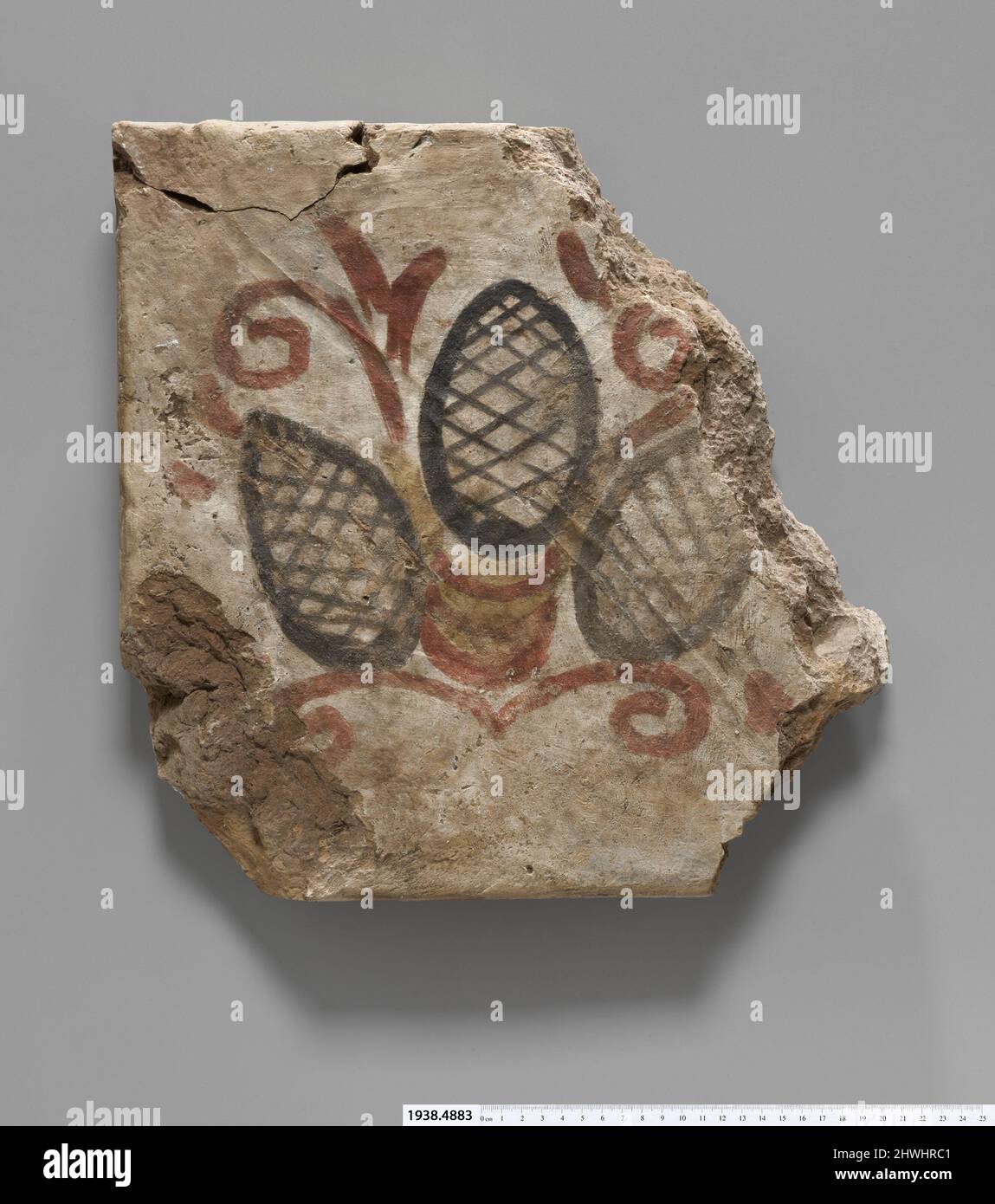 Painted tile with pine cone motif Stock Photo - Alamy