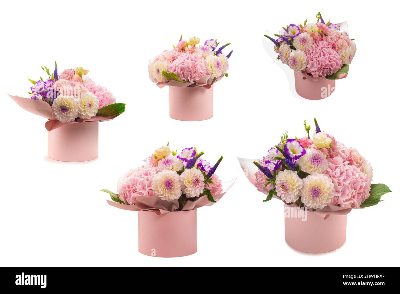 Pink and purple bouquet of flowers in a pink box isolated on white ...