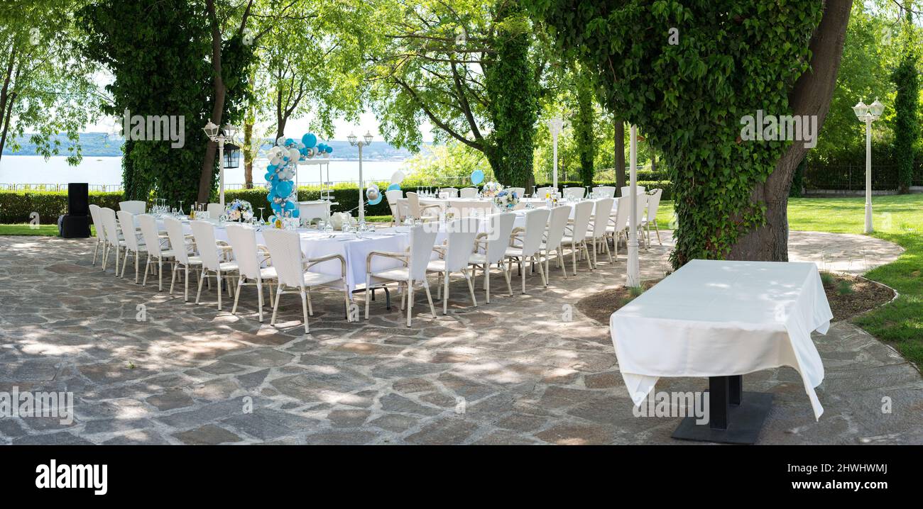 Panoramic view of a party table and a sweet table in the restaurant ...