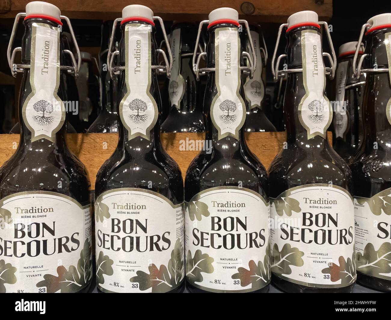 Liege, Belgium - March 3. 2022: Closeup of row beer bottles with logo ...