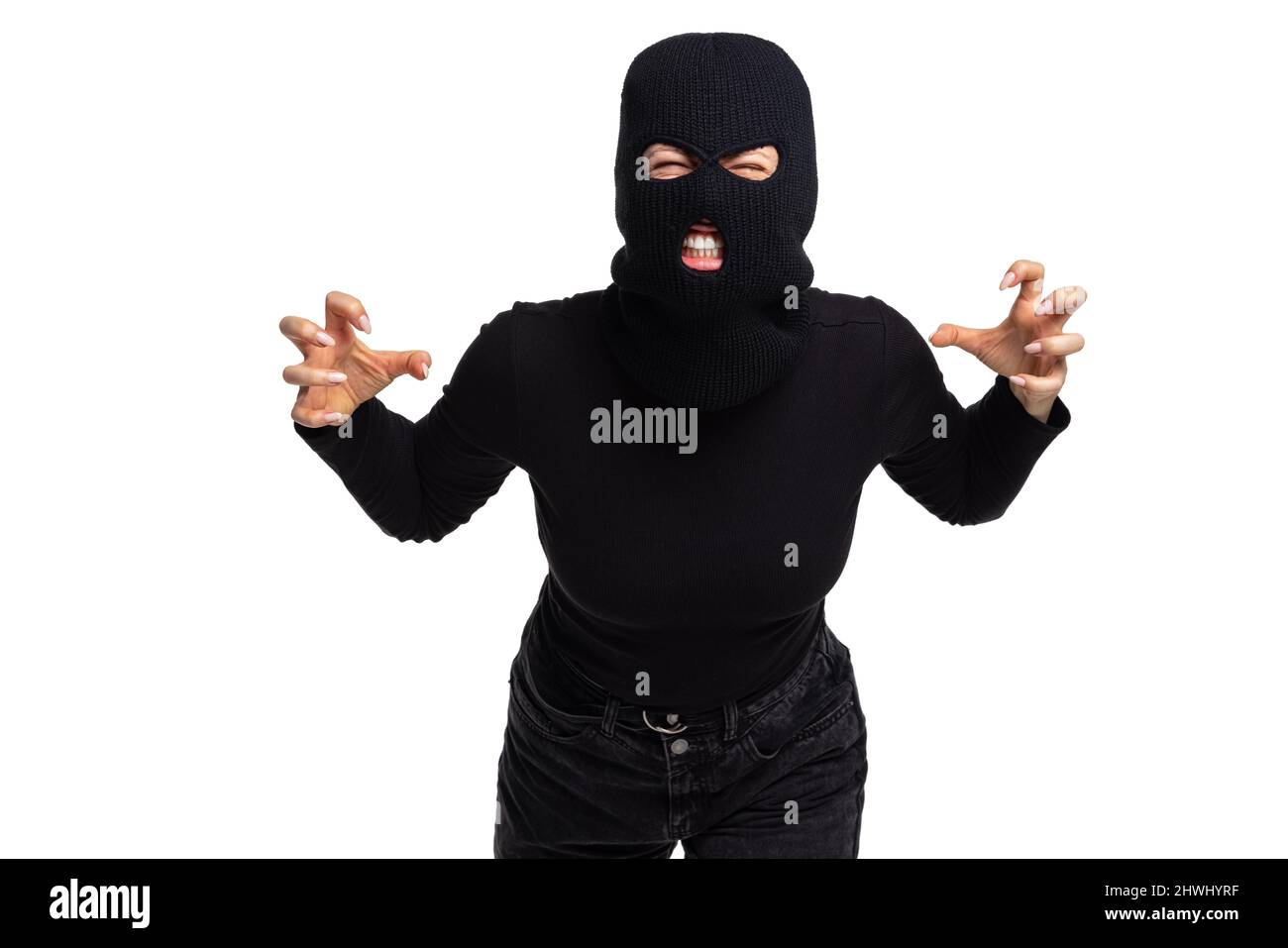Portrait of young anonymous person wearing black outfit and balaclava ...