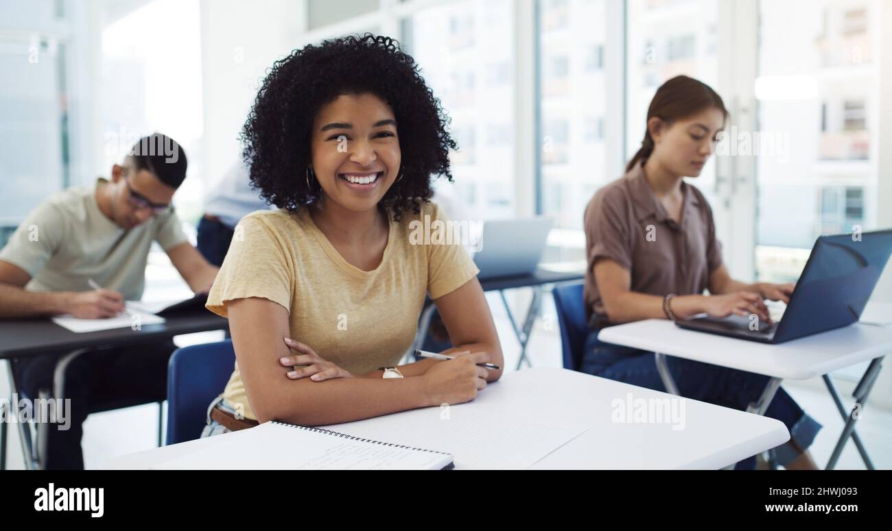 Learn as if youll live forever. Portrait of a happy young student among ...