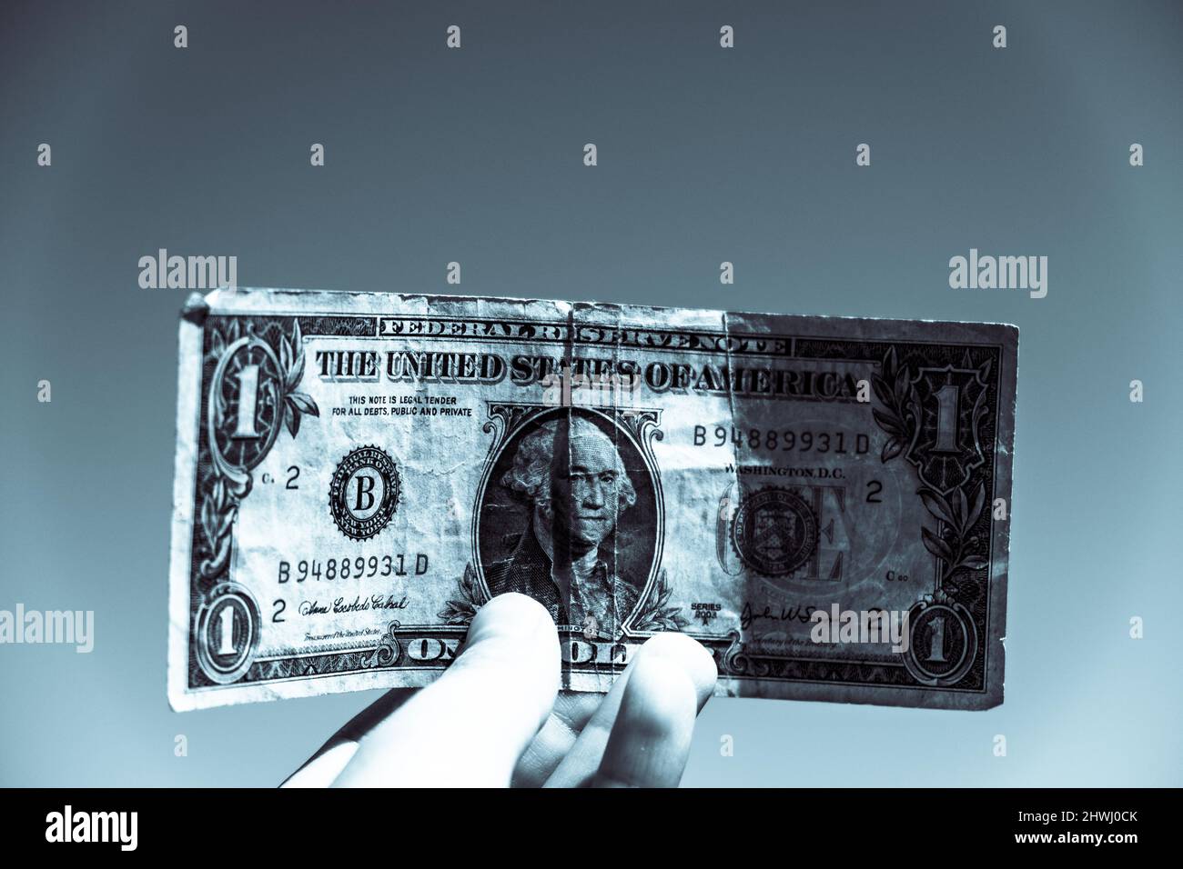 Dollars are in someone's hands. One dollar, two dollars, five dollars ...