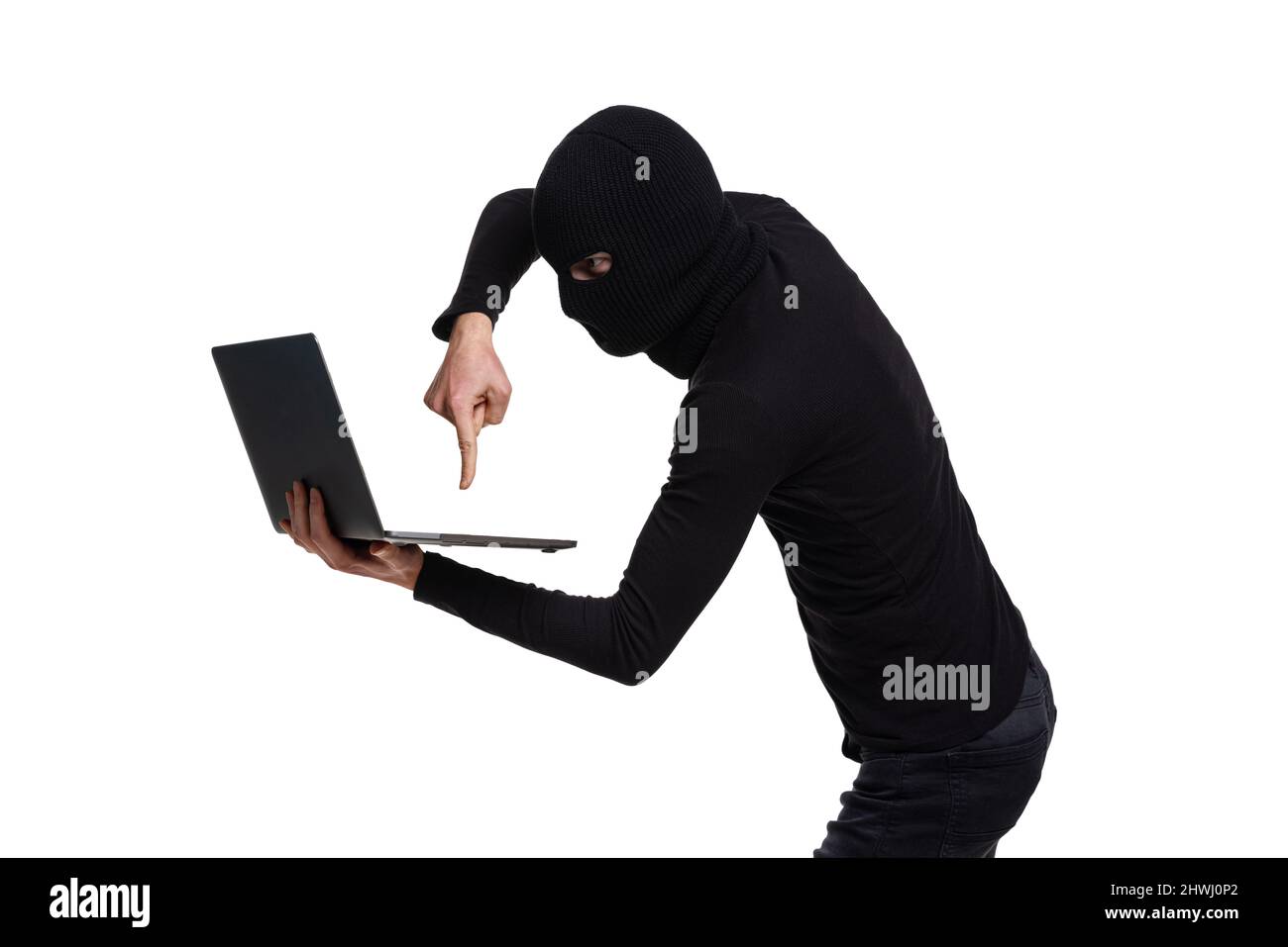 Portrait of young anonymous person wearing black outfit and balaclava ...