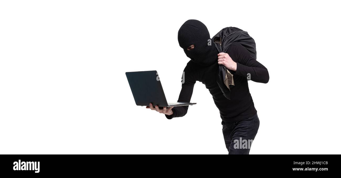 Portrait of young anonymous person wearing black outfit and balaclava ...