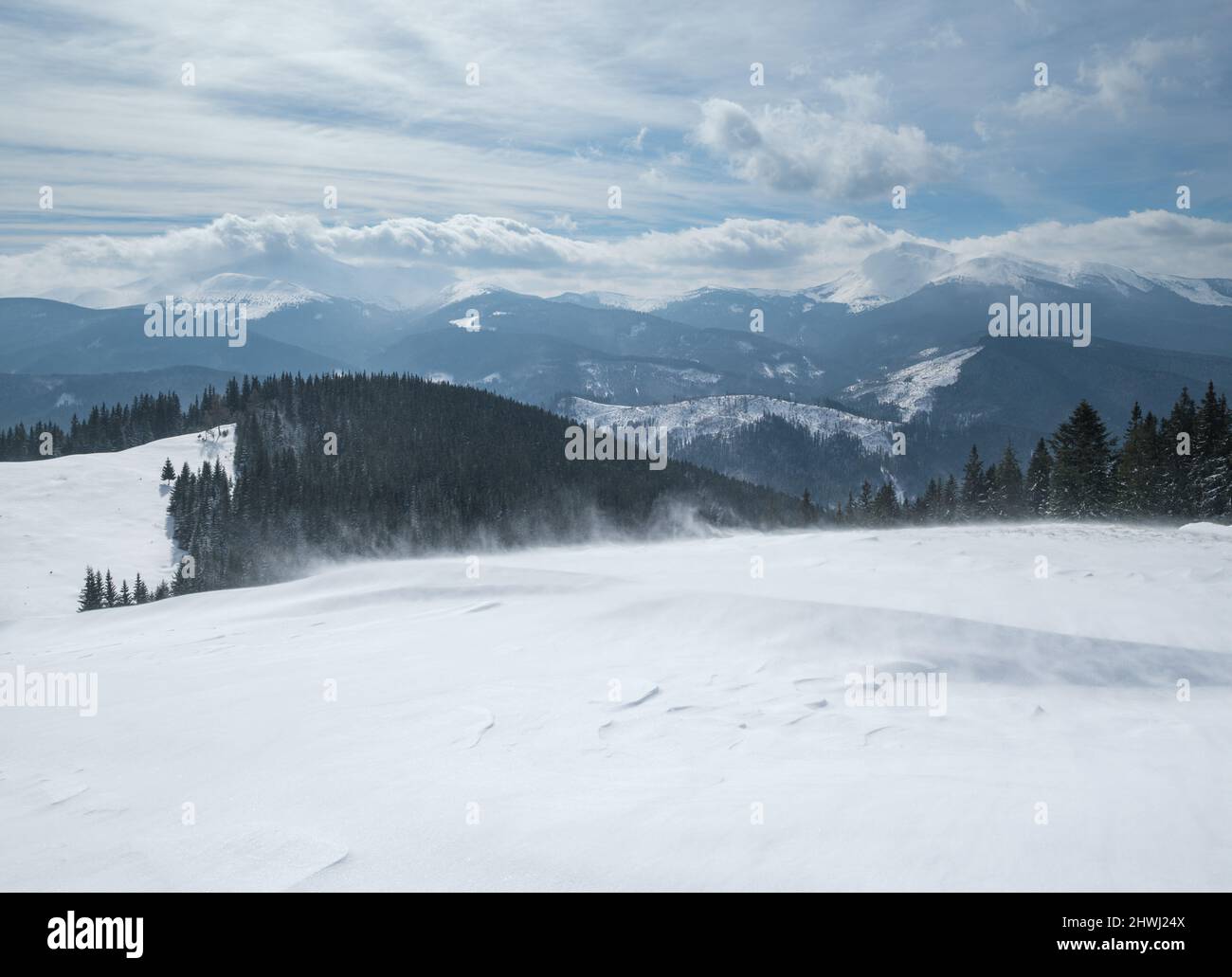 Winter remote alpine mountain village outskirts, countryside hills ...