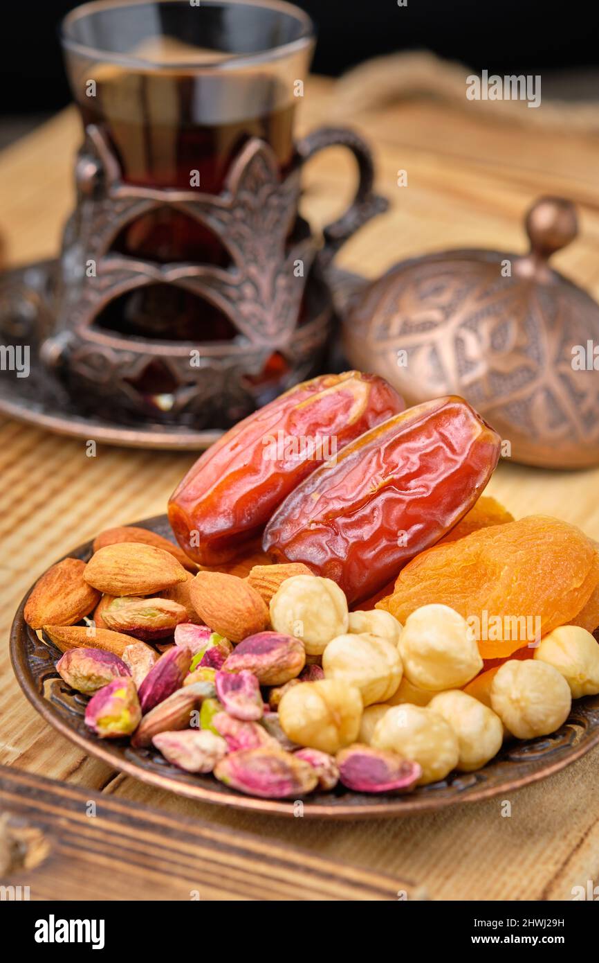 Dried fruits nut mix and arabic tea Stock Photo - Alamy