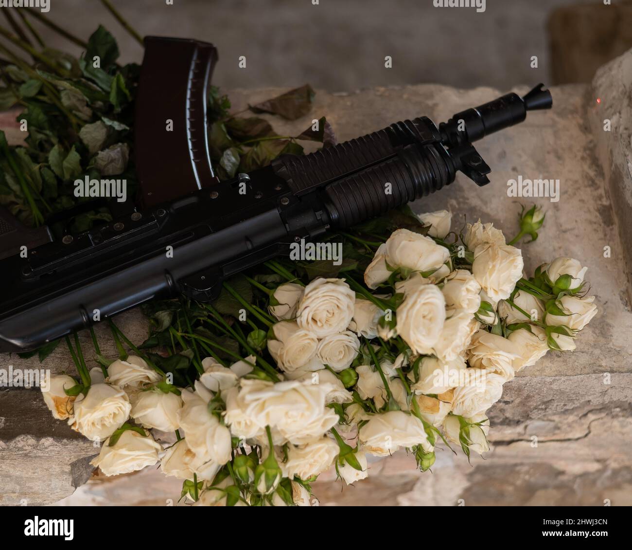 Automatic machine and a bouquet of small white roses Stock Photo - Alamy