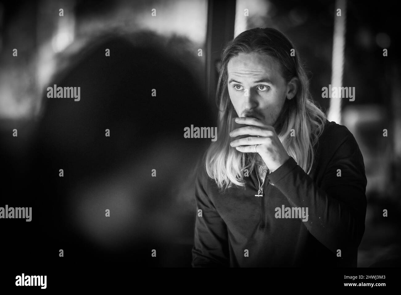 Young european male drinking cacao in a Cacao ceremony at Beachyjax ...