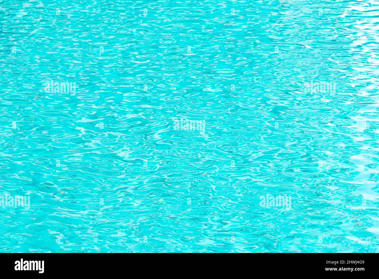 Ripple Water in swimming pool with blue tile floor background Stock ...