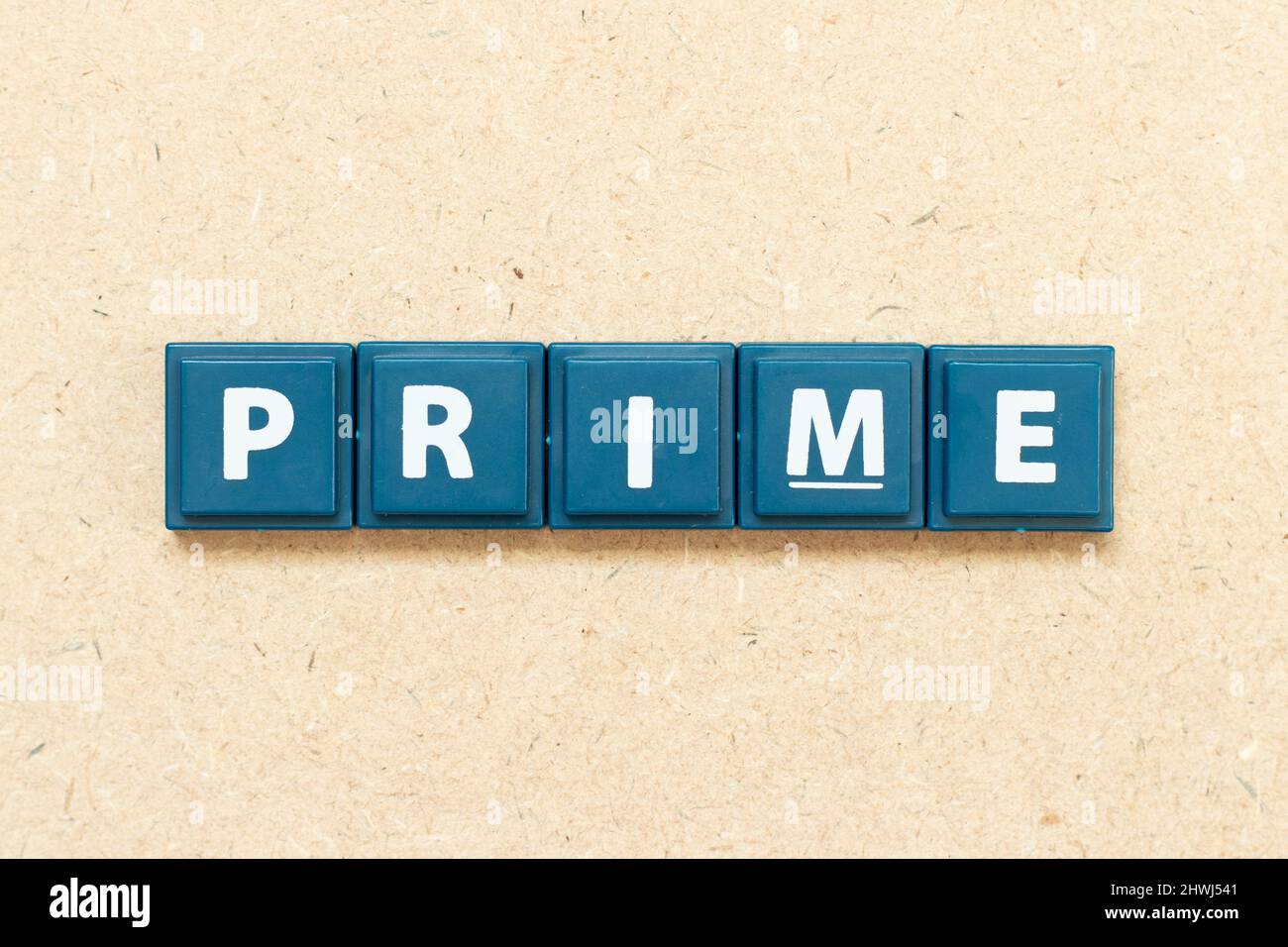 Tile alphabet letter in word prime on wood background Stock Photo - Alamy