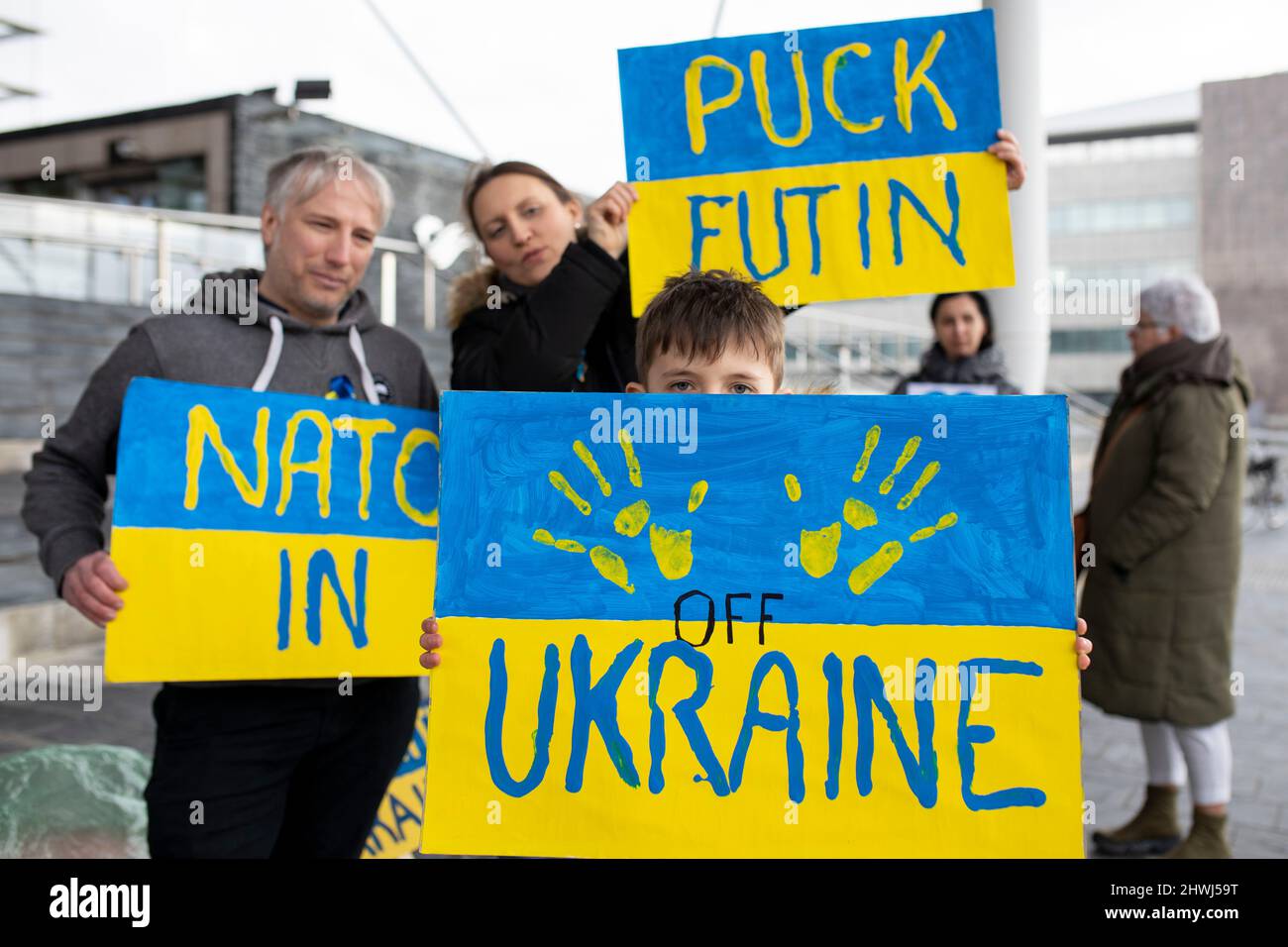 Cardiff, Wales, UK. 6th Mar, 2022. Protesters hold messages during an ...