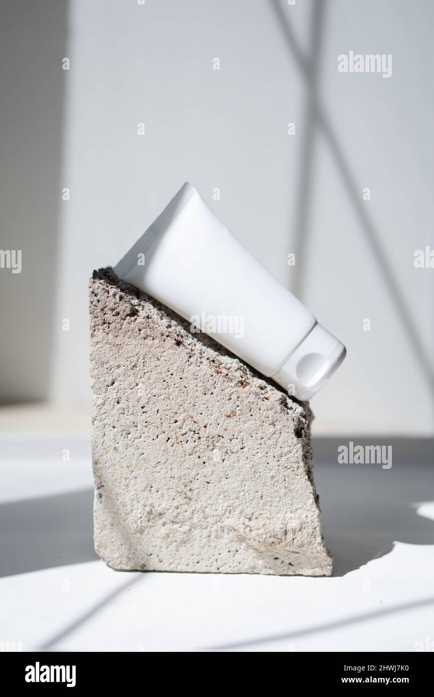 Clean white cream tube with trendy shadows and stone texture Stock ...