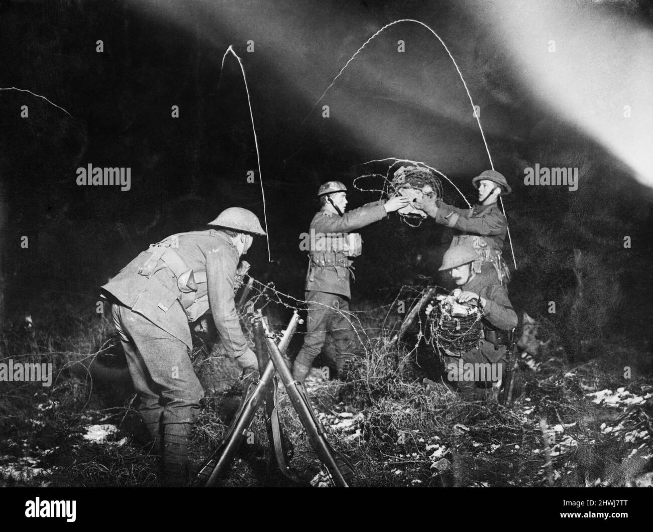 A wiring party at work at night in front of a support line. Note Very ...