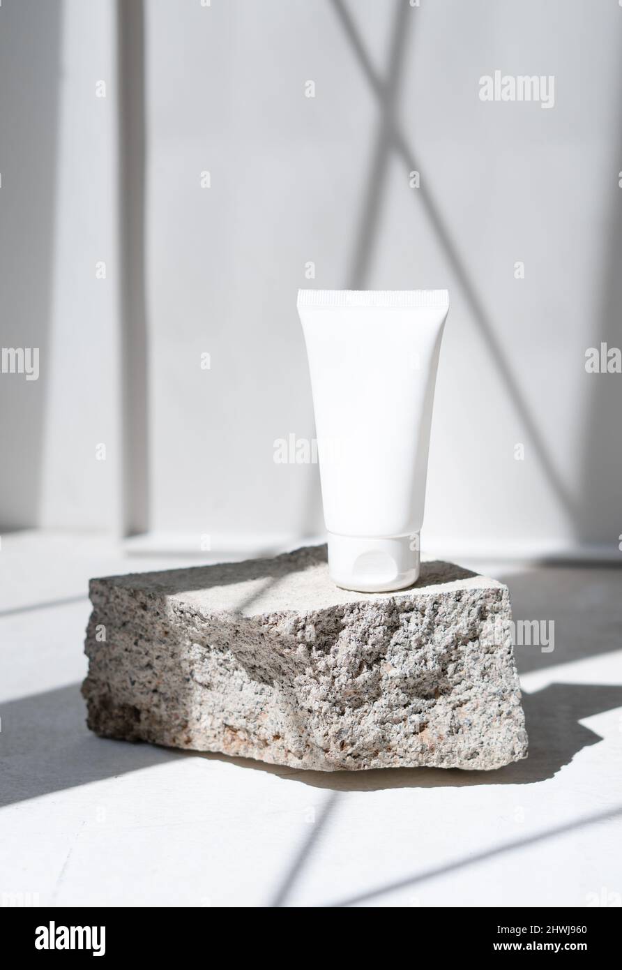 Clean white cream tube with trendy shadows and stone texture Stock ...