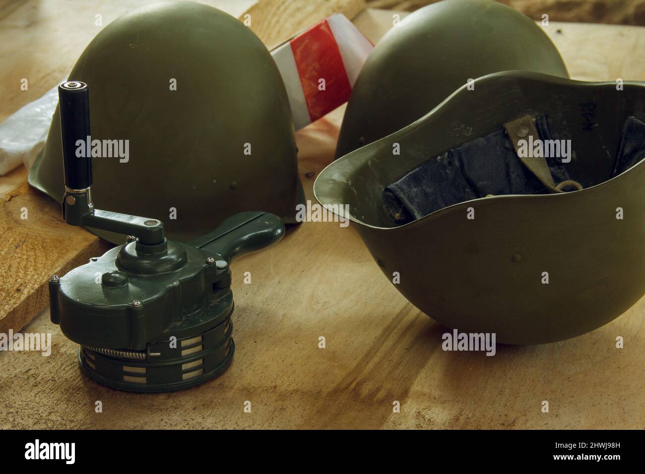 War. Military ammunition. Military helmets and hand siren. manual siren ...