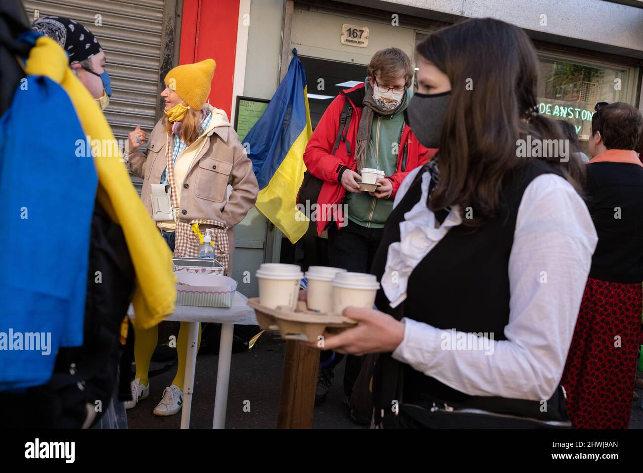 Glasgow, UK, 6th March 2022. Crowds gather to buy bakery goods, cakes ...
