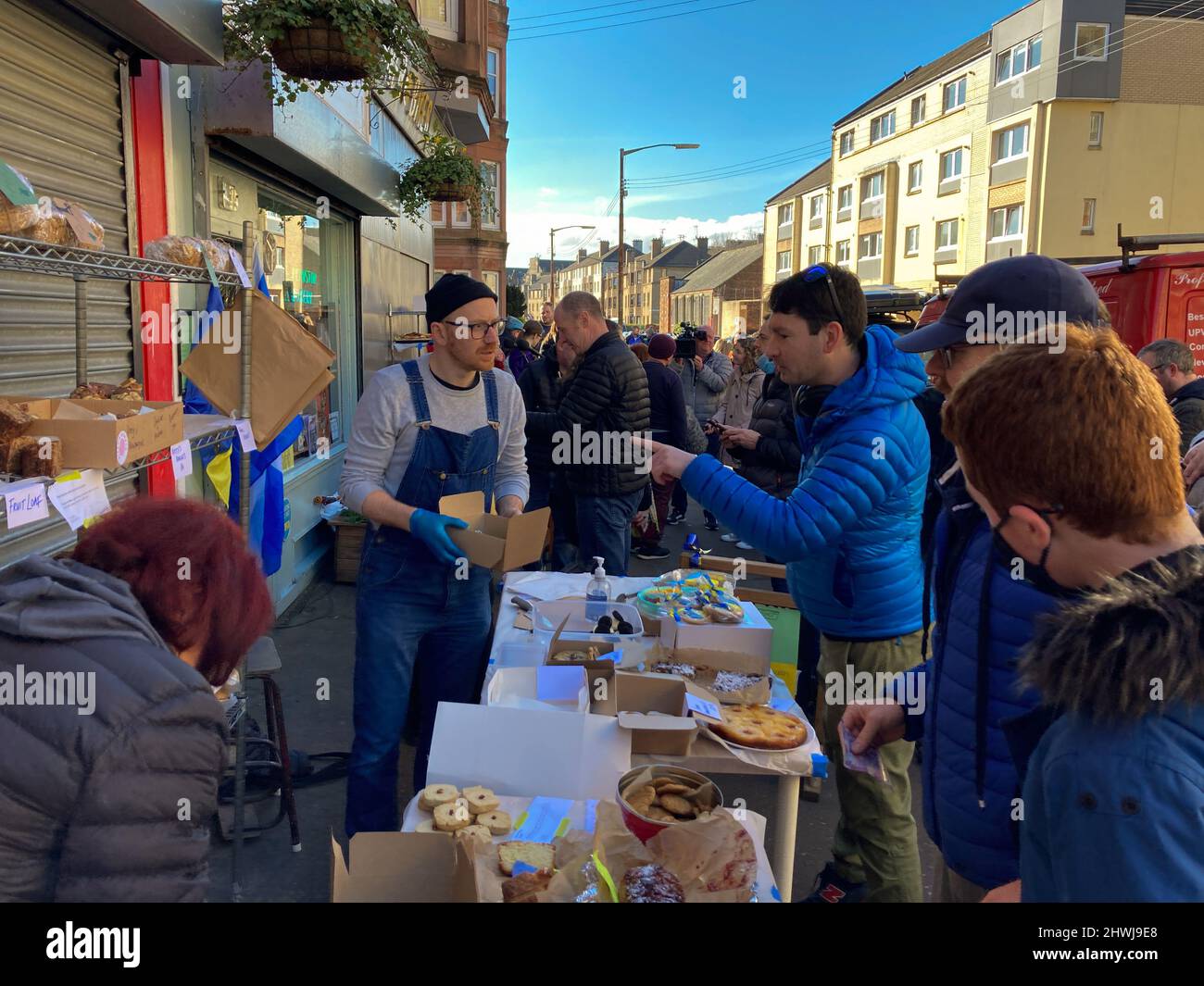 Glasgow, UK, 6th March 2022. Crowds gather to buy bakery goods, cakes ...