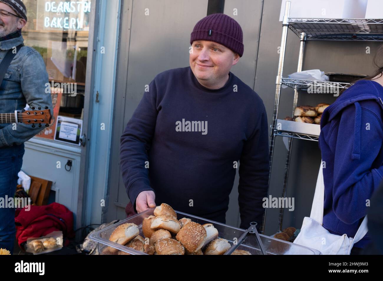 Glasgow, UK, 6th March 2022. Crowds gather to buy bakery goods, cakes ...