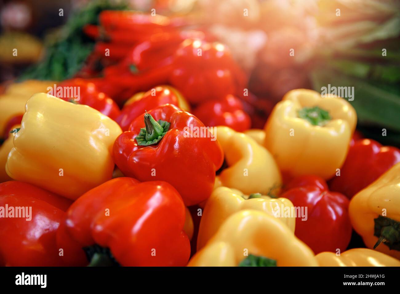 Red and yellow sweet paprika peppers on bazaar counter in Egypt with ...