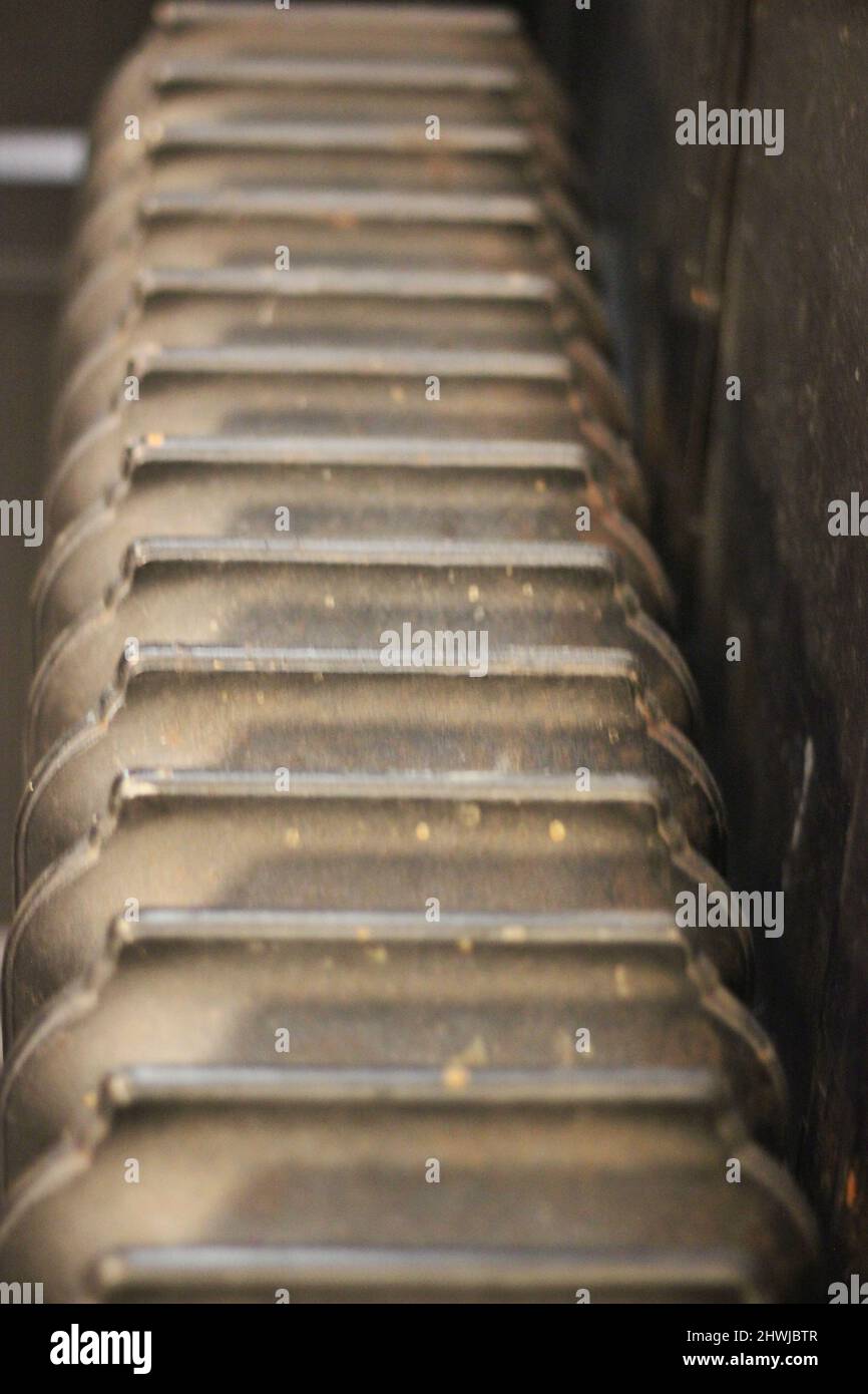 Vintage heavy iron radiator heating element with a repeat pattern of ...
