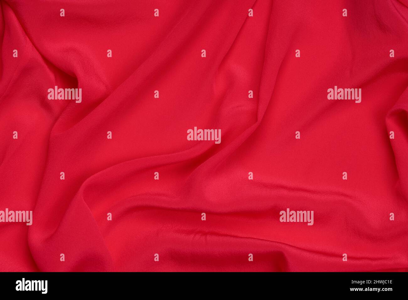 Abstract background of red silk fabric. Texture, luxury, fashion, style ...