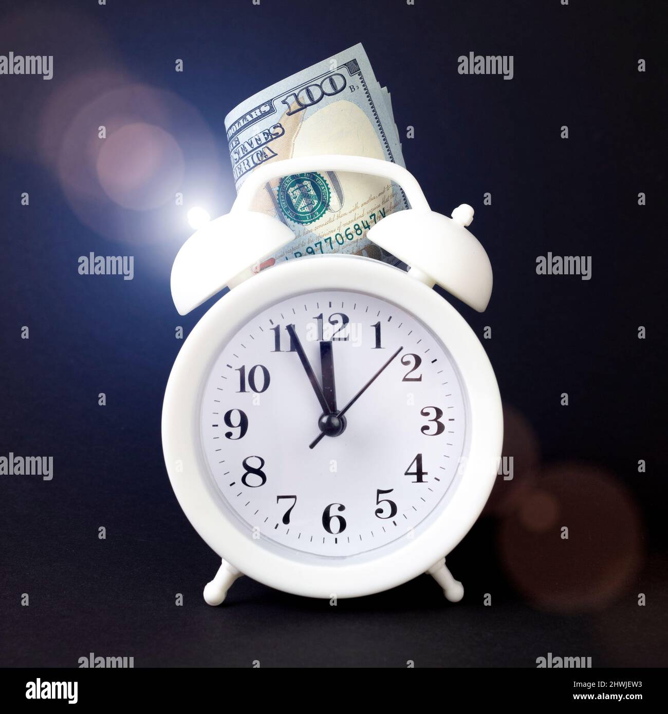 Alarm clock and dollars, close up. Time is money. Business concept ...