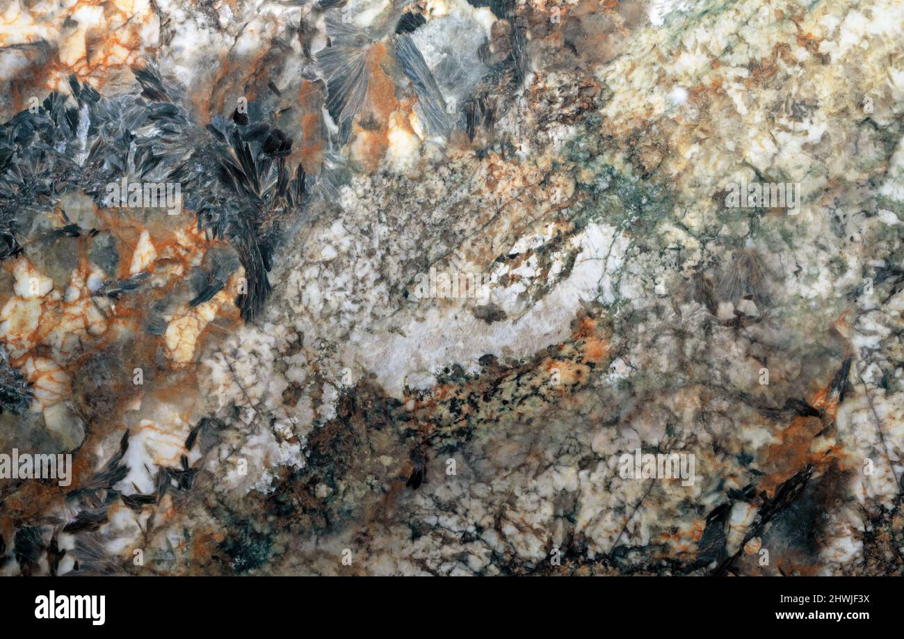 Texture of natural gray quartz stone with orange mineral inclusions ...