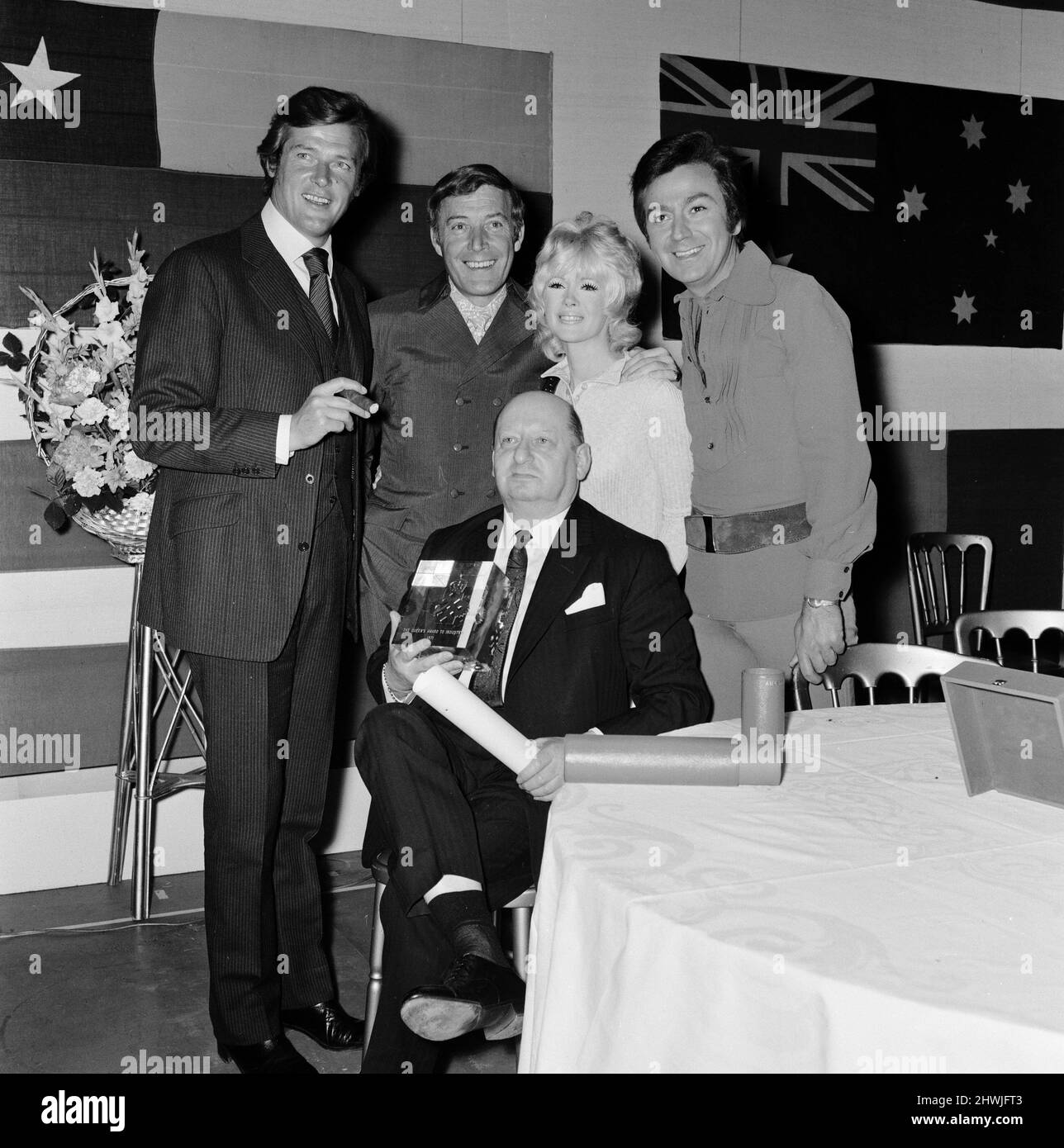Media Mogul Lew Grade holds the Queens Award for Industry trophy won by ...