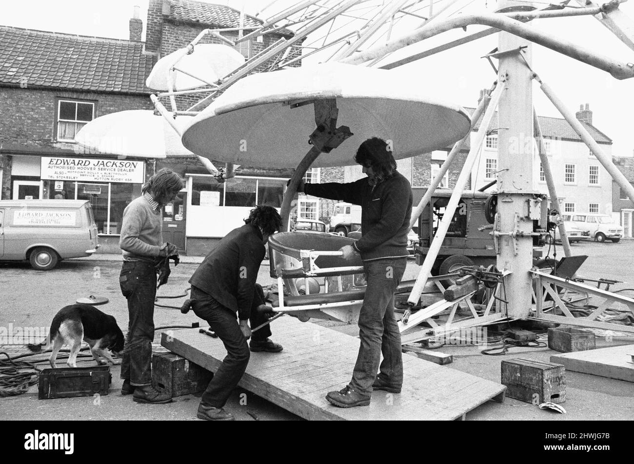 Fairground workers assembly a ride in Stokesley in preparation of the ...