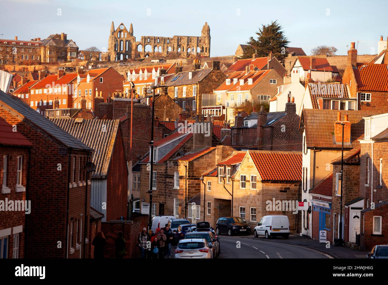 View of Whitby Abbey from Spital Bridge area of Whitby at dusk, North ...