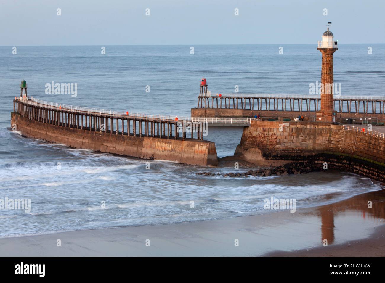 Beach and pier at Whitby Sea Wall and Entrance to the River Esk Estuary ...
