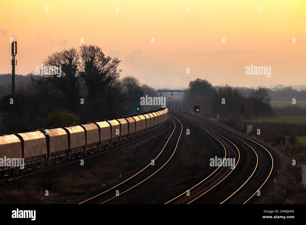 Merry go round coal freight train running along a 4 track railway line ...