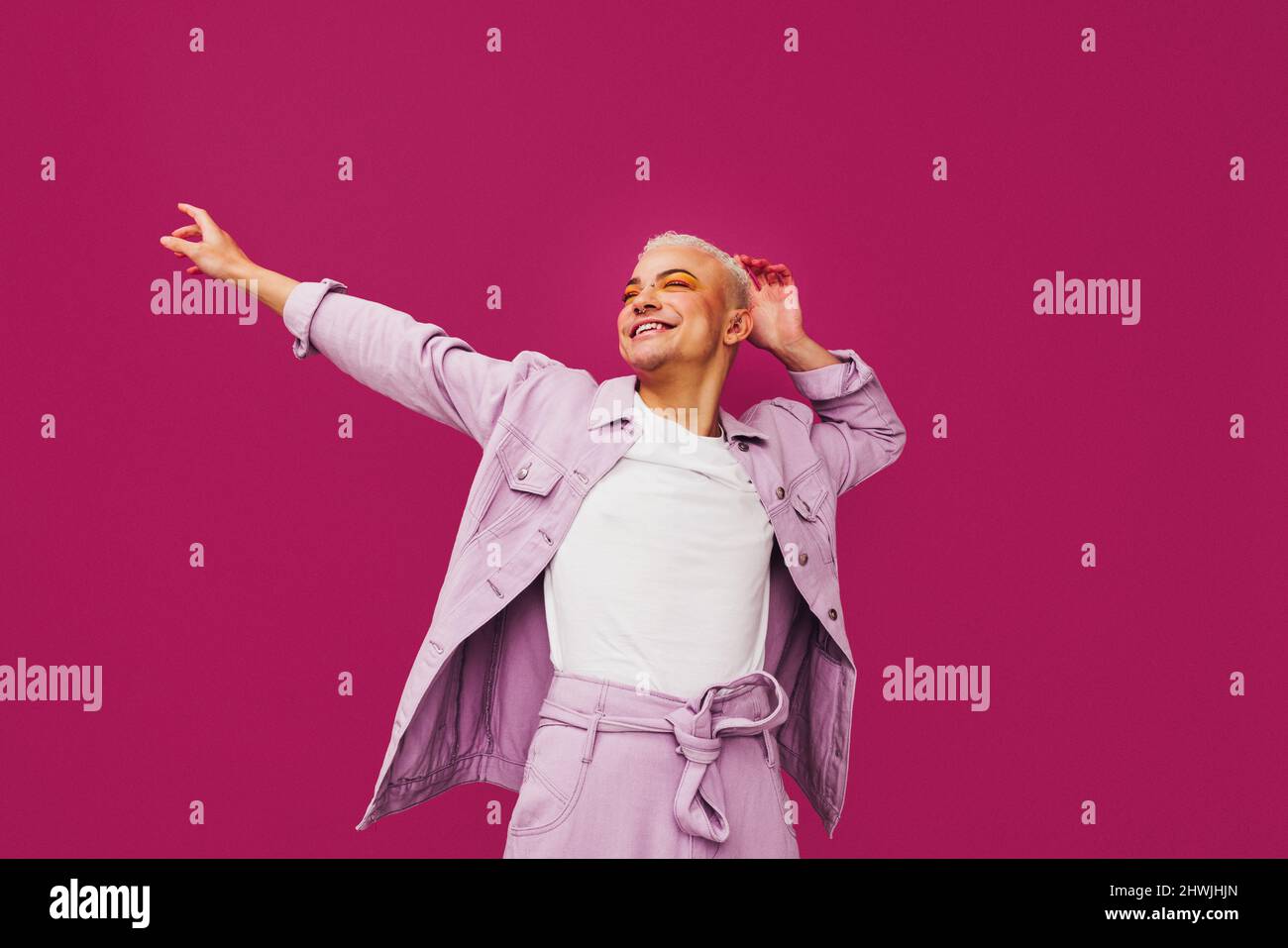 Celebrating the beauty of life. Happy queer man celebrating with his ...