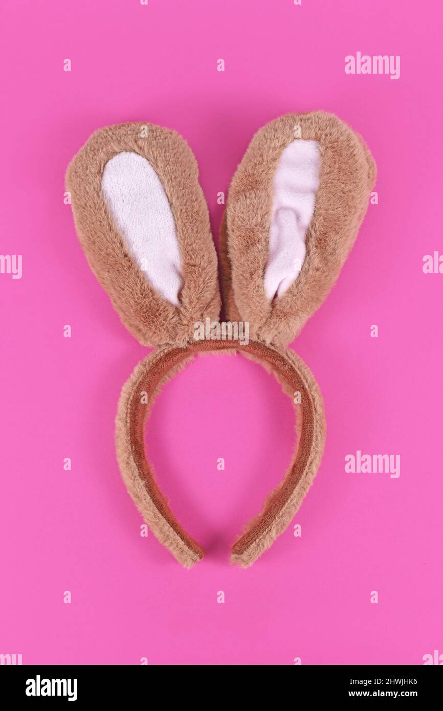 Cute costume easter bunny ears headband on pink background Stock Photo ...
