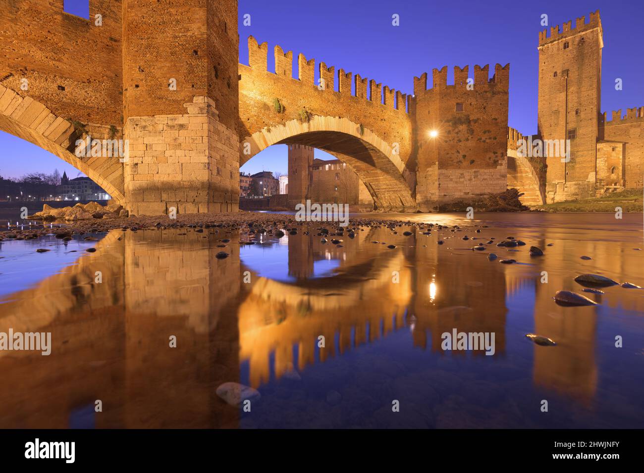 Castelvecchio Bridge over the Adige River in Verona, Italy at twilight ...