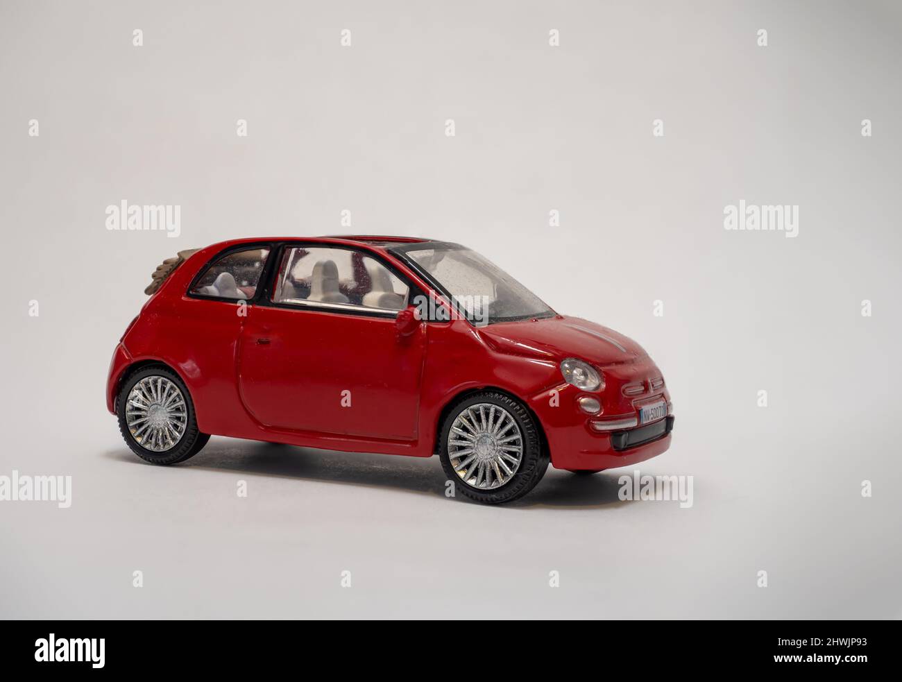 Front and side view of a red cabriolet Fiat 500 metal model car to ...
