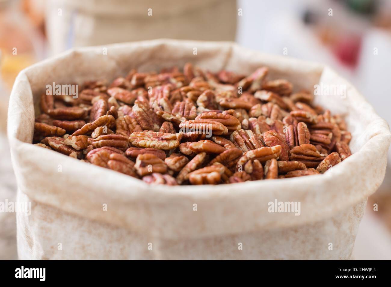 Image of dark pecan in container Stock Photo - Alamy