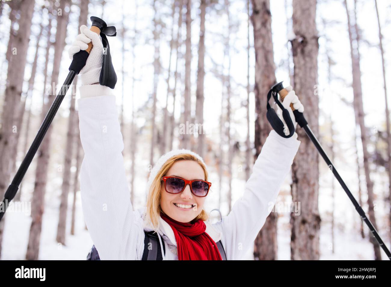 Girl In Red And White Outfit Hiking In A Forest With Snow On A Winter 2951