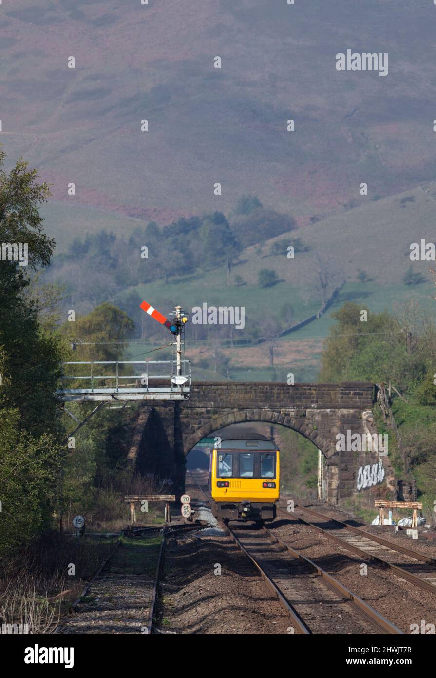 Northern Rail class 142 pacer train 142037 passing a upper quadrant semaphore bracket railway ...